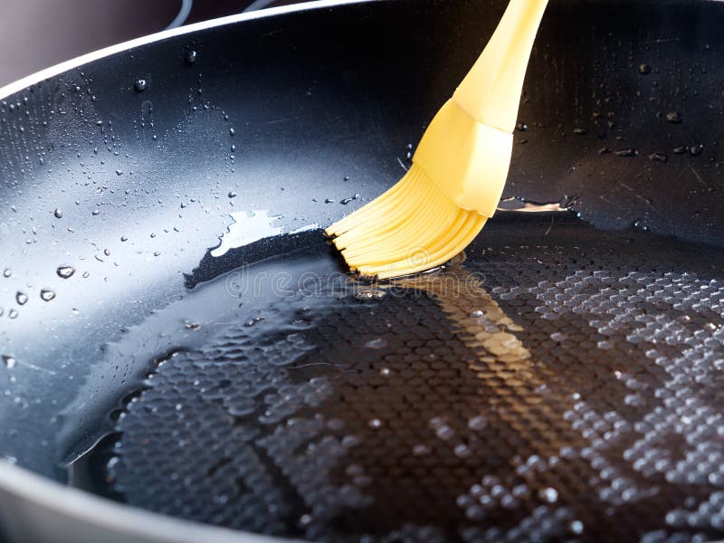 Greasing Pan by Silicone Brush Stock Image - Image of closeup, grease ...