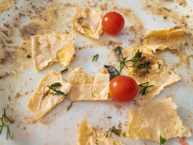 Greasy Plate Full of Pita and Tomato Leftovers Stock Image - Image of ...