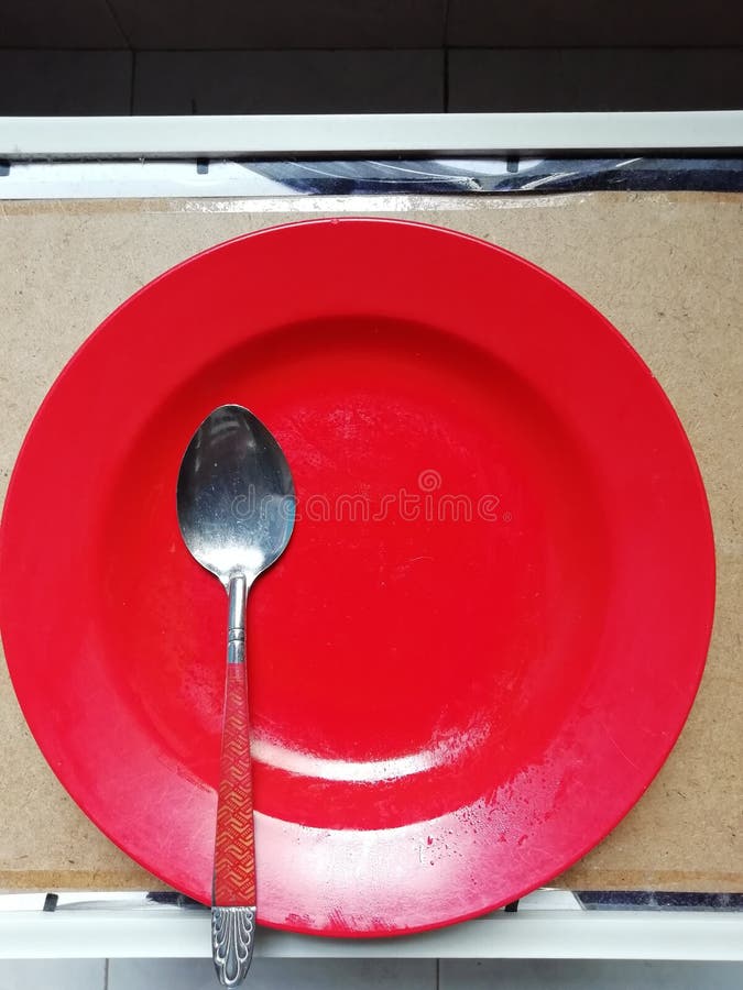 Greasy Red Plate with Spoon Suitable for Food Stock Image - Image of ...