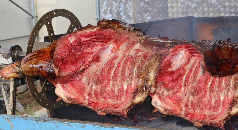 Great Beef Cooked on a Spit with the Embers Stock Photo - Image of food ...