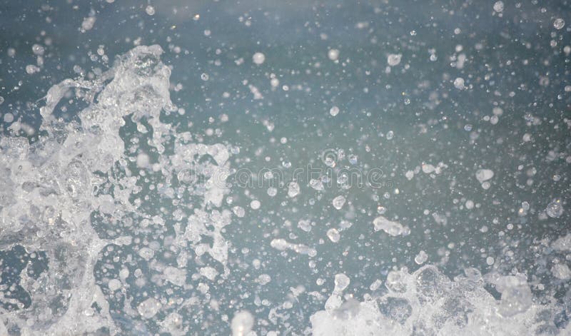 Great Capture of Water Drops Spraying into the Air Stock Photo - Image ...