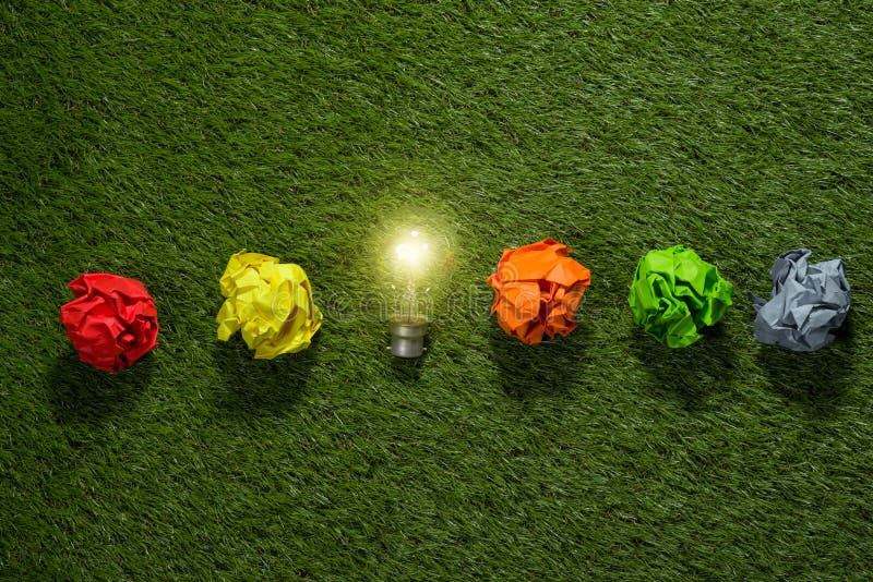 Great Concept with Crumpled Office Paper and Light Bulb Standing on the ...