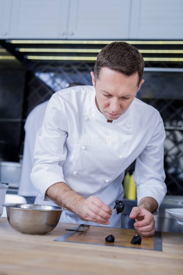Great Cook Preparing a Delicious Dinner for the Guests Stock Photo ...