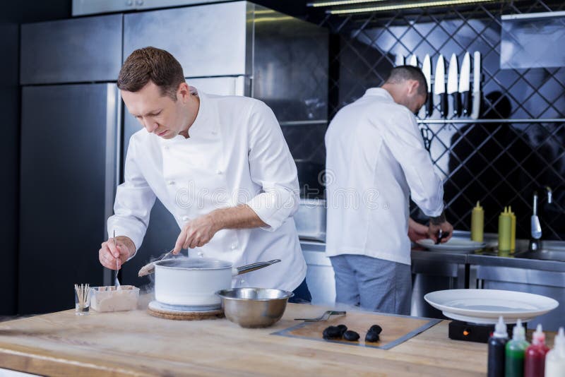 Great Cooks Working in the Kitchen Together Stock Image - Image of ...