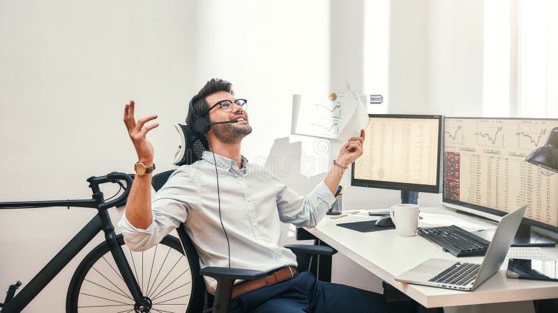 Great Happy and Successful Bearded Trader in Headset Holding Financial ...