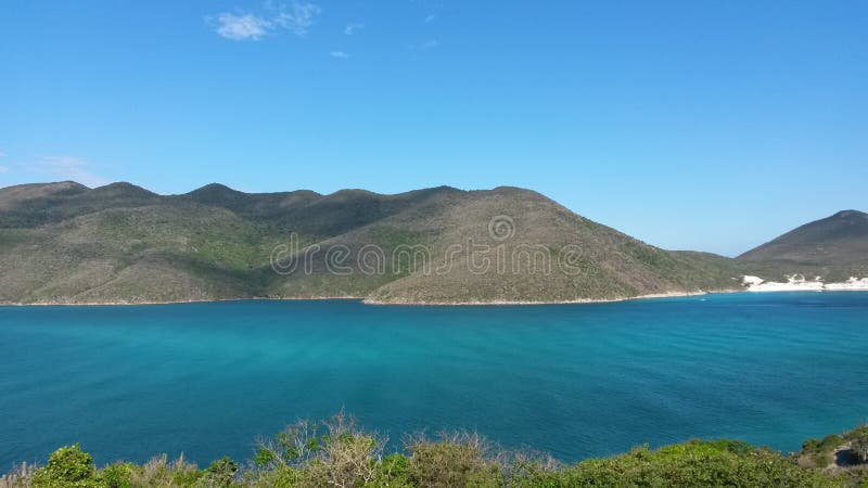 Great Mountain and Oceanic Beach with Blue Waters on a Blue Clear Sky ...