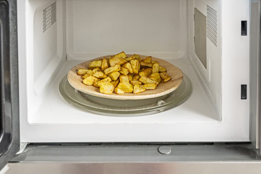A Great Plate of Chips Inside a Microwave Stock Photo - Image of snack ...