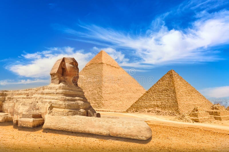 The Great Sphinx and Pyramids in Giza Against Blue Cloudy Sky in Giza, Cairo, Egypt Stock Photo ...