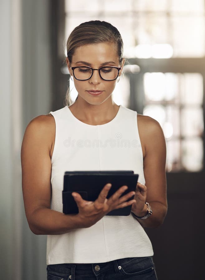 A Great Task Management Tool. a Young Businesswoman Using a Digital ...