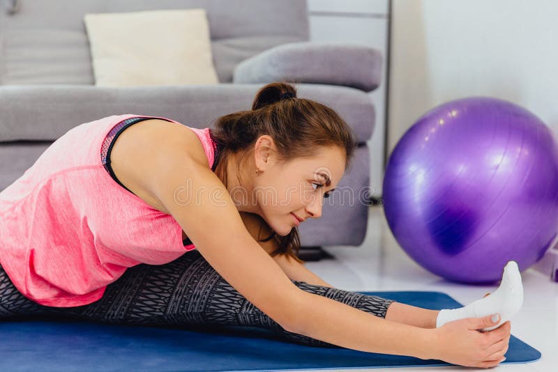 A Great Young Girl Makes Different Kinds of Exercises Stretch Marks ... A Great Young Girl Makes Different Kinds of Exercises Stretch Marks ...