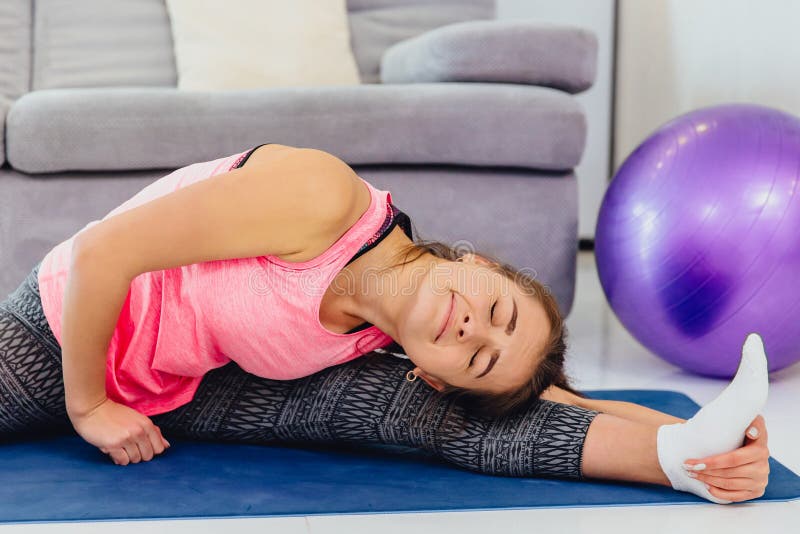 A Great Young Girl Makes Different Kinds of Exercises Stretch Marks ... A Great Young Girl Makes Different Kinds of Exercises Stretch Marks ...