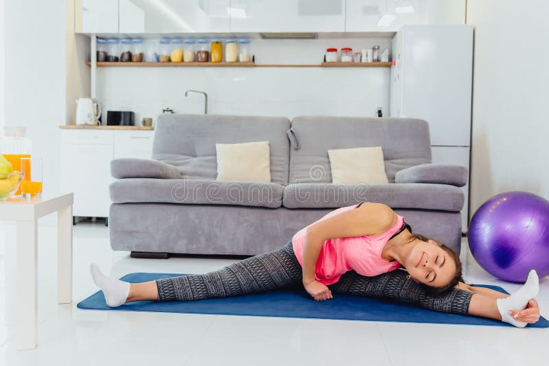 A Great Young Girl Makes Different Kinds of Exercises Stretch Marks ... A Great Young Girl Makes Different Kinds of Exercises Stretch Marks ...