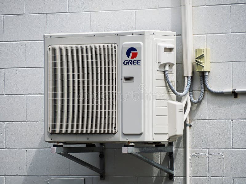 Gree Air Conditioning Unit Mounted at Exterior White Brick Wall ...