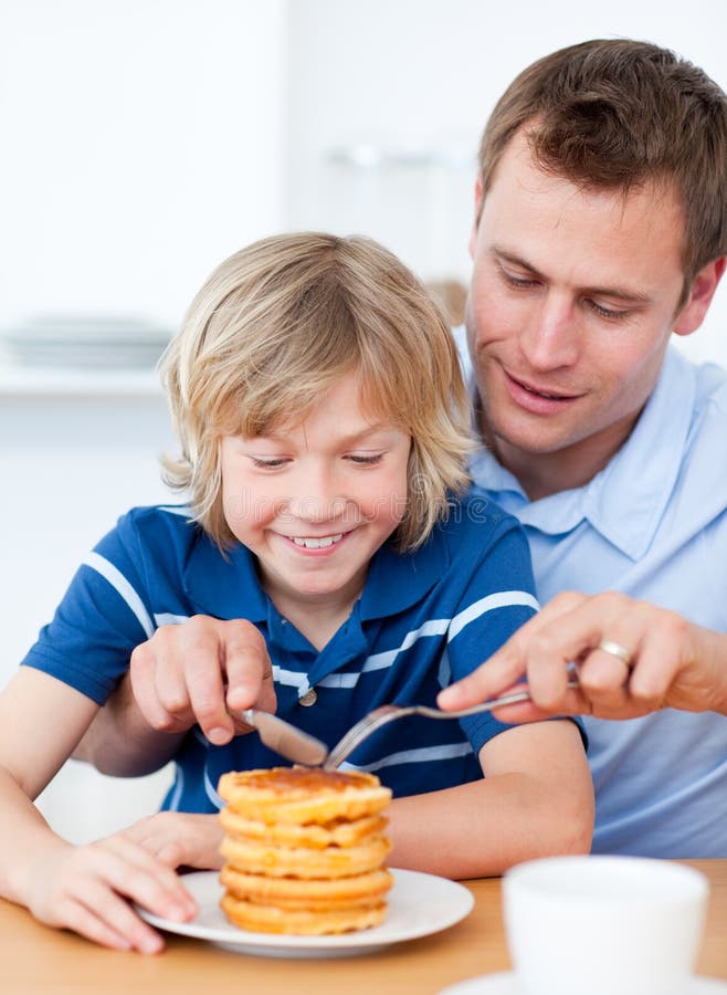 Greedy Boy and His Father Putting Honey on Waffles Stock Image - Image ...