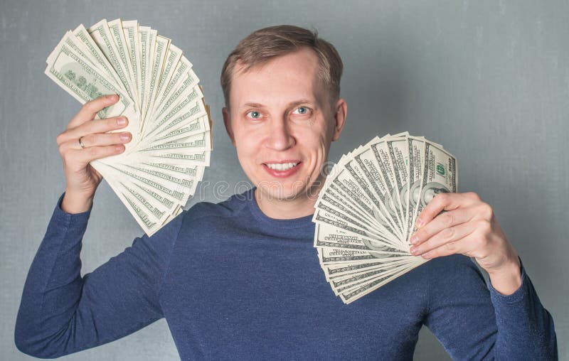 Greedy Man Displaying a Spread of Dollars Stock Photo - Image of ...