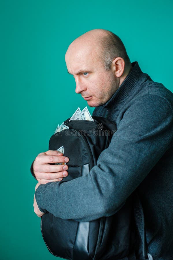 Greedy Man Holding a Black Bag of Money Stock Image - Image of ...