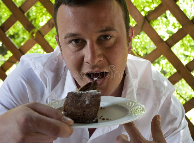 Greedy Young Man with Cake stock image. Image of eating - 15044517