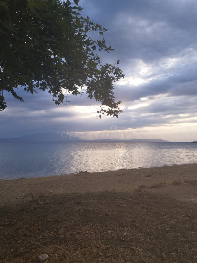Greek Beach, Sea and Sunset in the Clouds Stock Photo - Image of greek ...