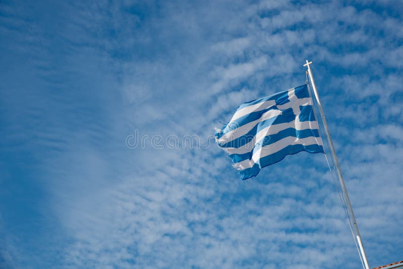 Greek Blue and White Flag Waving Against a Blue Dramatic Cloudy Sky ...