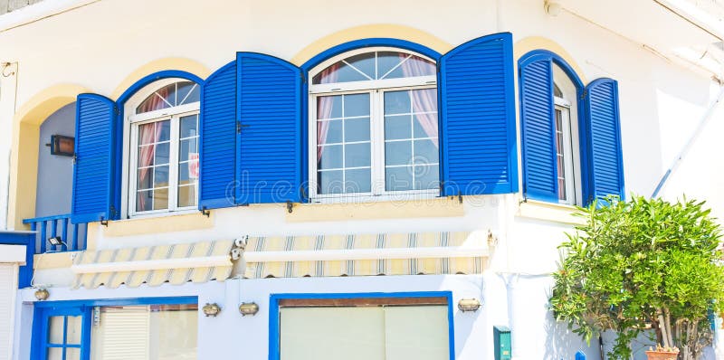 Greek blue windows stock image. Image of ancient, bricks - 10775675