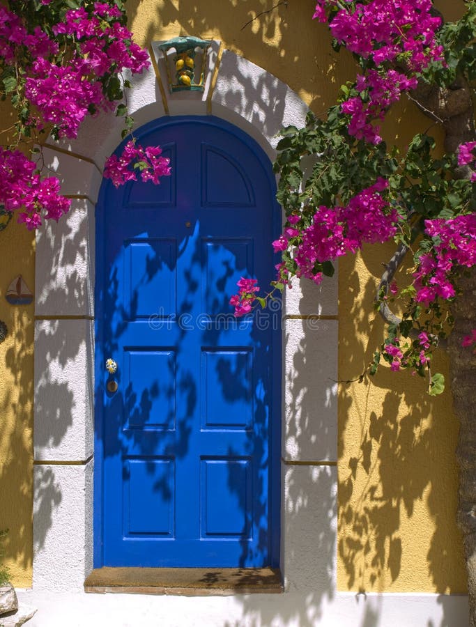 Blue Door in Greece with Purple Flower Stock Photo - Image of glass ...