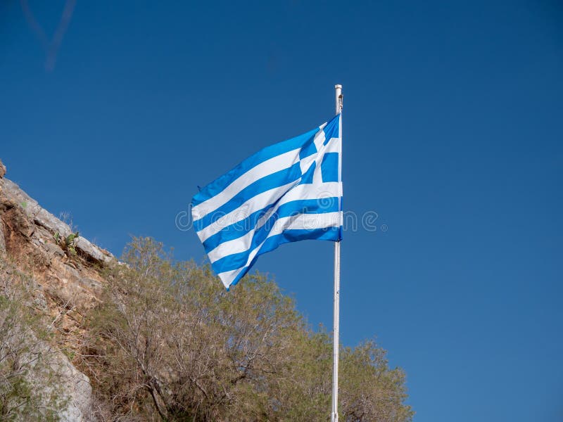 Greek flag flying on Crete stock photo. Image of proud - 130621324
