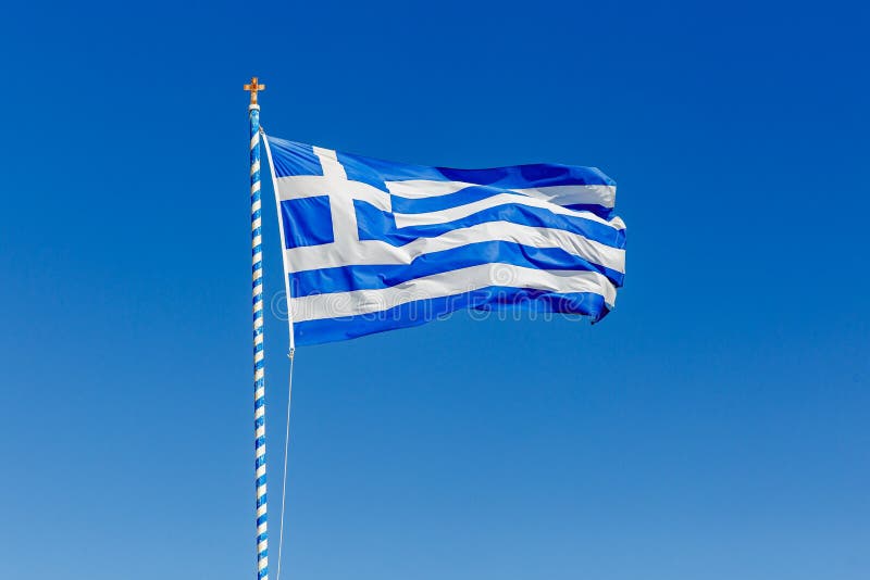 Greek Flag Waving Against the Blue Sky Stock Photo - Image of santorini ...