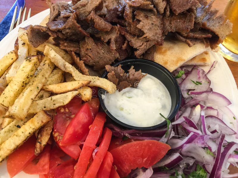 Greek Gyros with Fried Potatoes Stock Photo - Image of dressing, bread ...