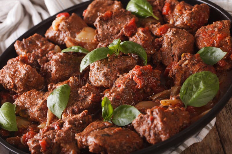 Greek Stifado Beef with Sauce on the Plate Macro. Horizontal Stock ...