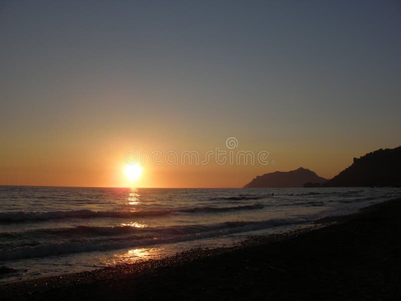 Greek sunset stock photo. Image of pebble, light, mountains - 48751558