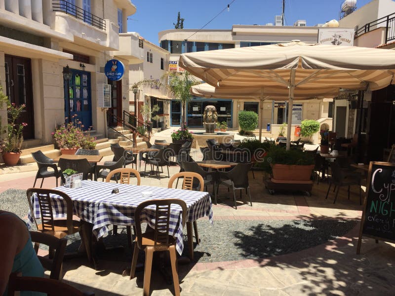 Greek Taverna By The Sea With A Blue Traditional Wooden Chairs And ...