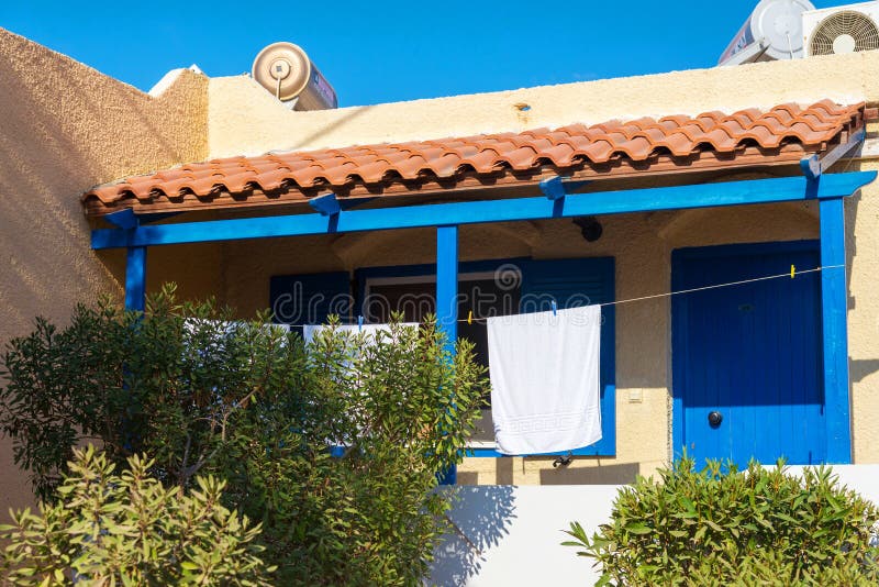 Greek Yellow House with Blue Wood Elements Stock Image - Image of ...