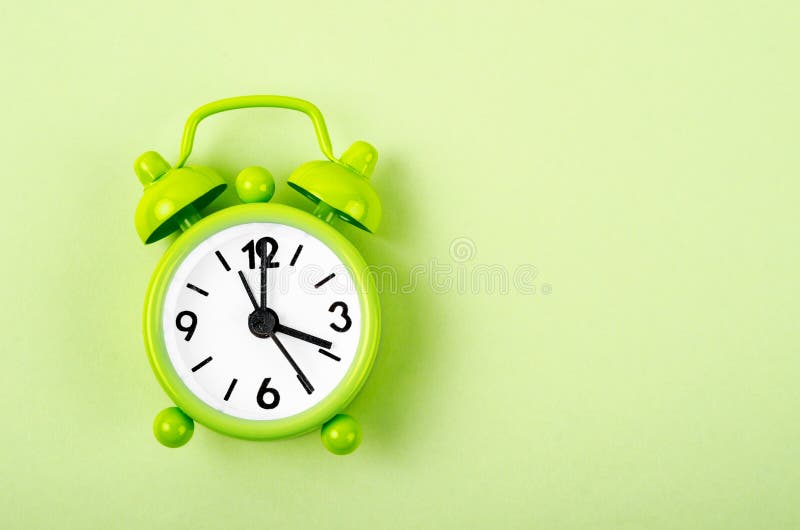 The Green Alarm Clock on Green Colour Background Stock Image - Image of ...