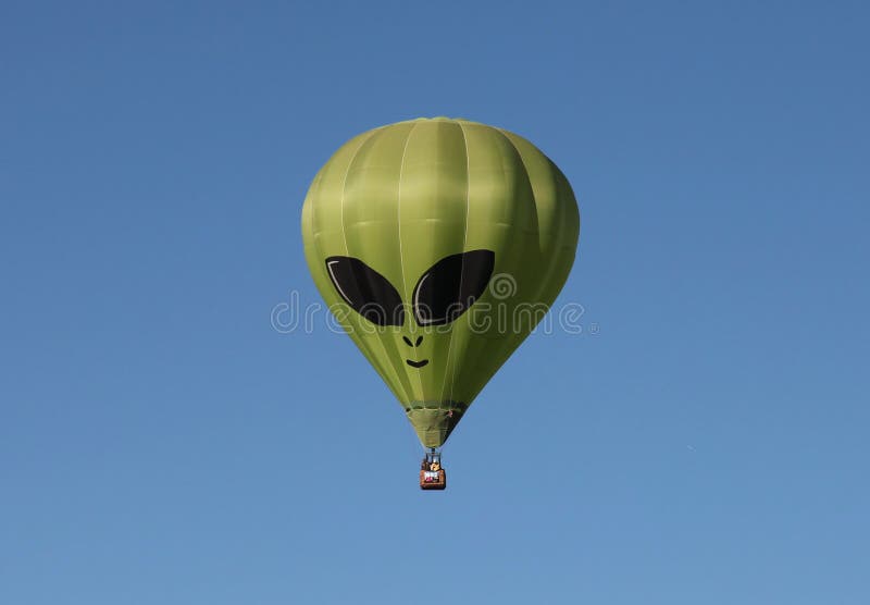 Green Alien Hot Air Balloon Against a Blue Sky Stock Image - Image of ...
