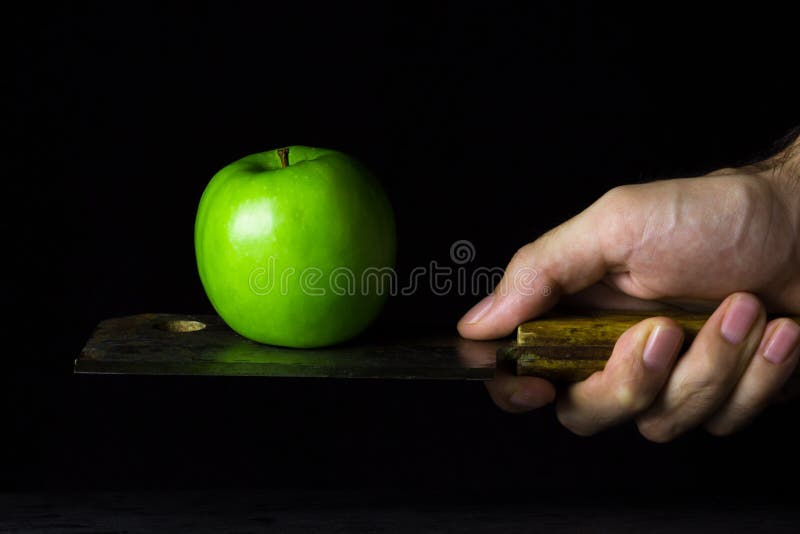 Green Apple on a Black Background. an Apple is Standing on a Kitchen ...