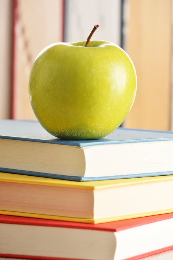 Green Apple and Books on the Table Stock Image - Image of eating ...