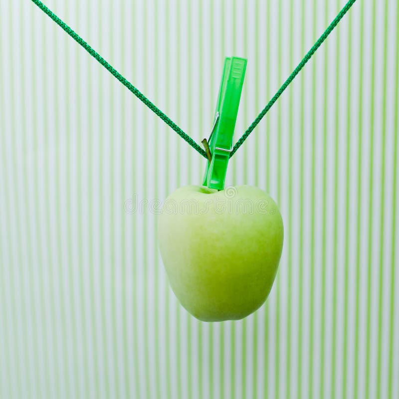 Green Apple Hanging on the Rope Stock Photo - Image of clothespin ...