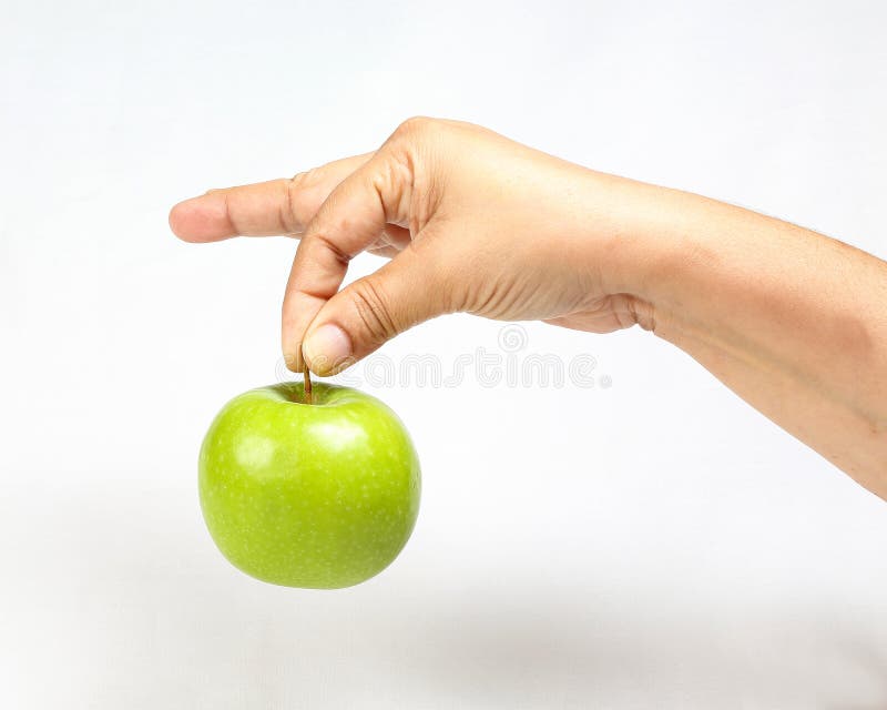 Green apple held by hand stock image. Image of green - 75628229