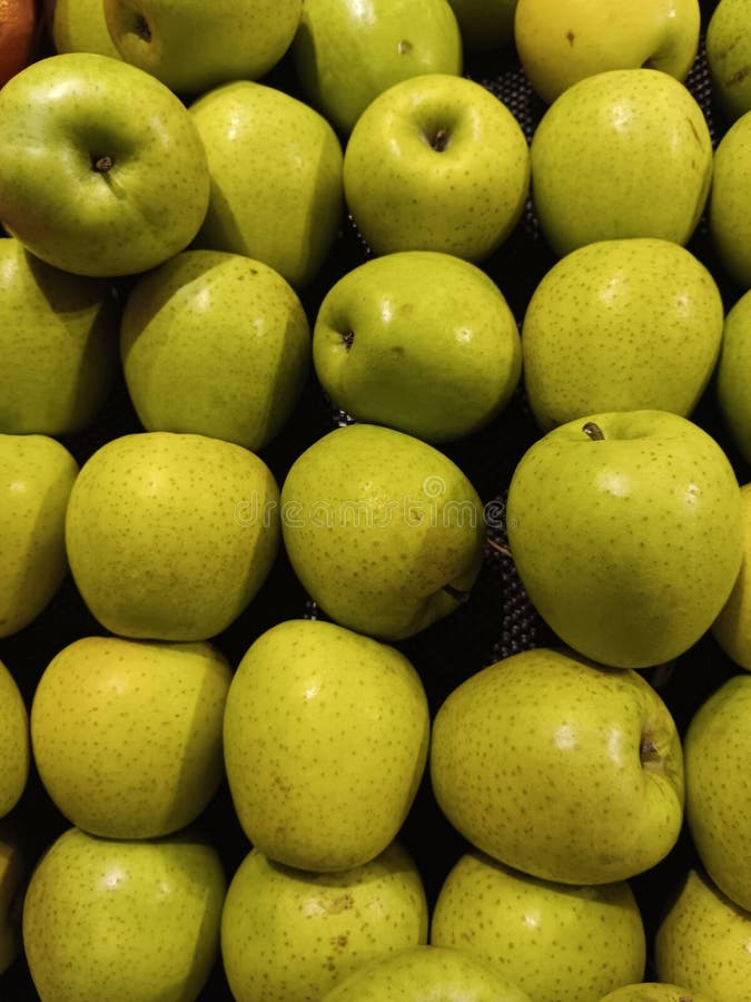 Green Apple with Natural Dark Spots on Skin Stock Photo - Image of ...