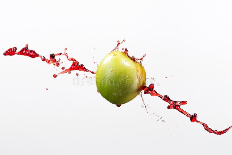 Green Apple and Splash of Red Juice on White Background. Stock Photo ...