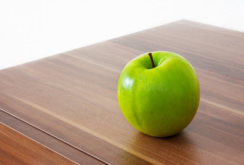 Green apple on the table stock image. Image of vitamin - 46811451