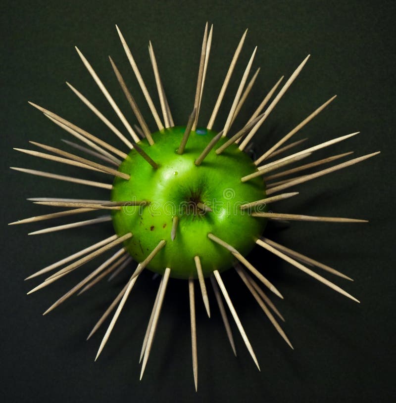Green Apple in Toothpicks Isolated on Black Stock Photo - Image of ...