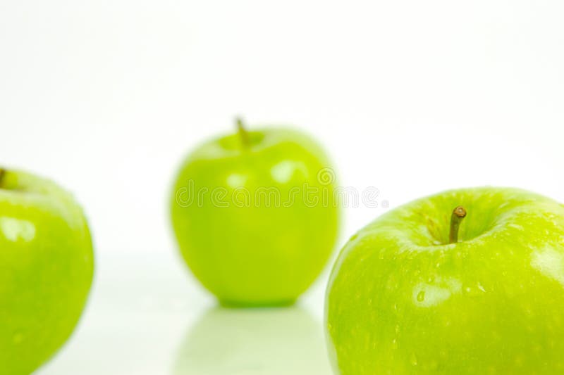 Four green apples in a row stock image. Image of dieting - 7363621