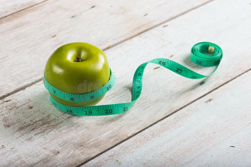 Green apples measured stock image. Image of measurement - 69867535