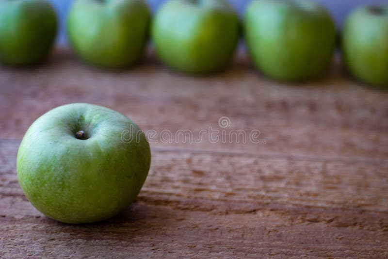 Green Apples Stand on a Wooden Surface Stock Image - Image of fruit ...