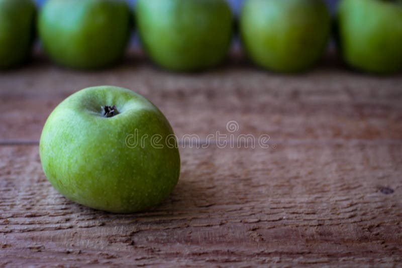 Green Apples Stand on a Wooden Surface Stock Photo - Image of healthy ...