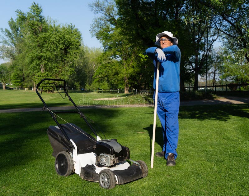 Maintenance Worker Cleaning Solar Panels at Industrial Solar Cell Farm ...