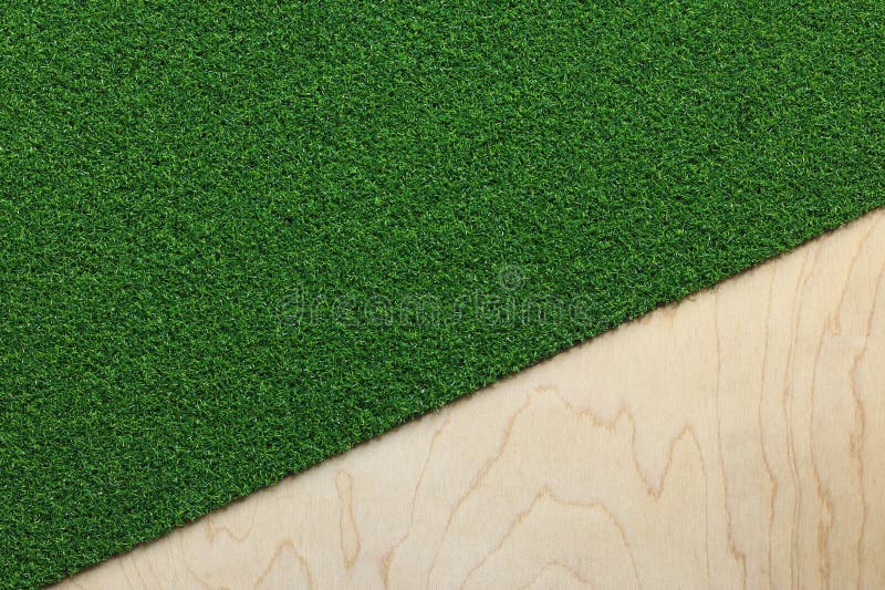 Green Artificial Grass Rug on a Wooden Background Stock Image - Image ...
