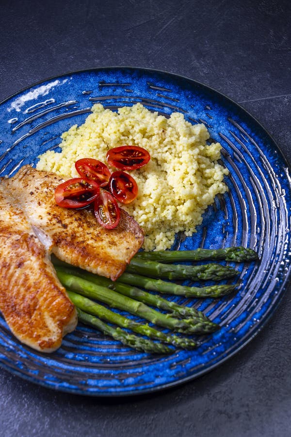 Green Asparagus with Fish Fillet and Couscous Stock Photo - Image of ...