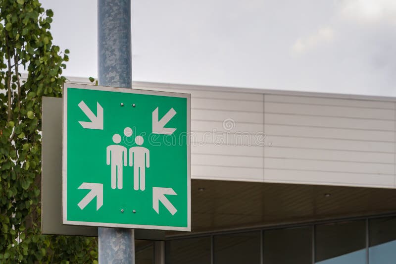 Green Assembly Point Sign Outside the Building Stock Photo - Image of ...
